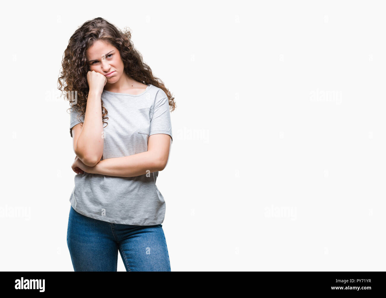 Beautiful young brunette curly hair girl wearing casual look over ...