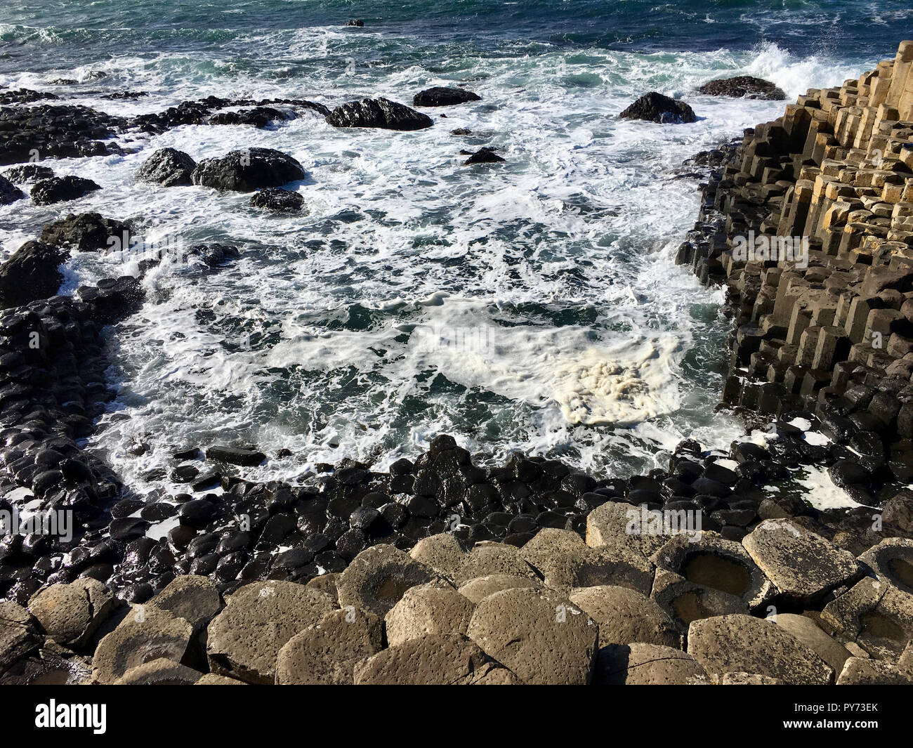 Overhead view of the hexagon shaped basalt stones along the coast of ...