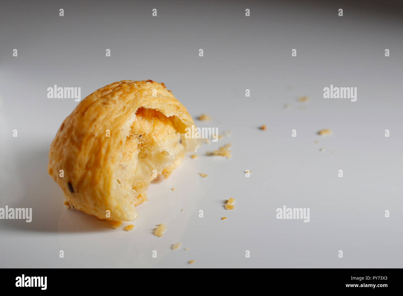 Smashed, isolated salted croissant with sesamo Stock Photo - Alamy