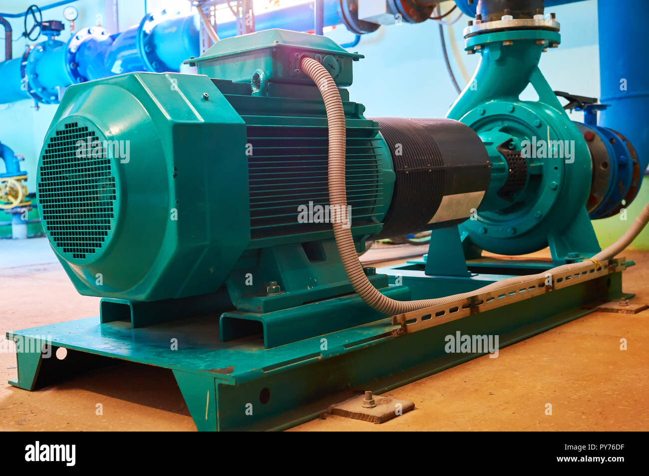 Blue motor pump standing on a metal stand Stock Photo - Alamy