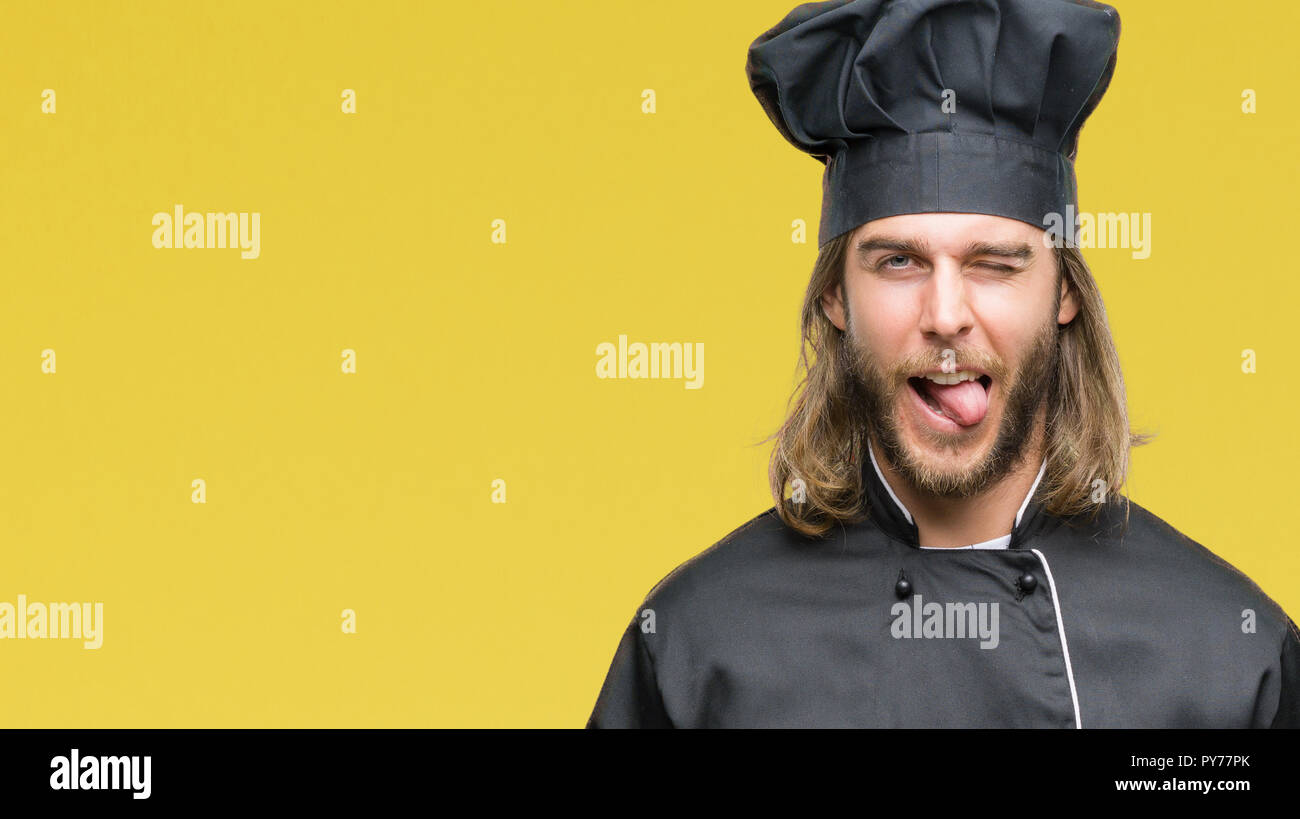 Young handsome cook man with long hair over isolated background ...