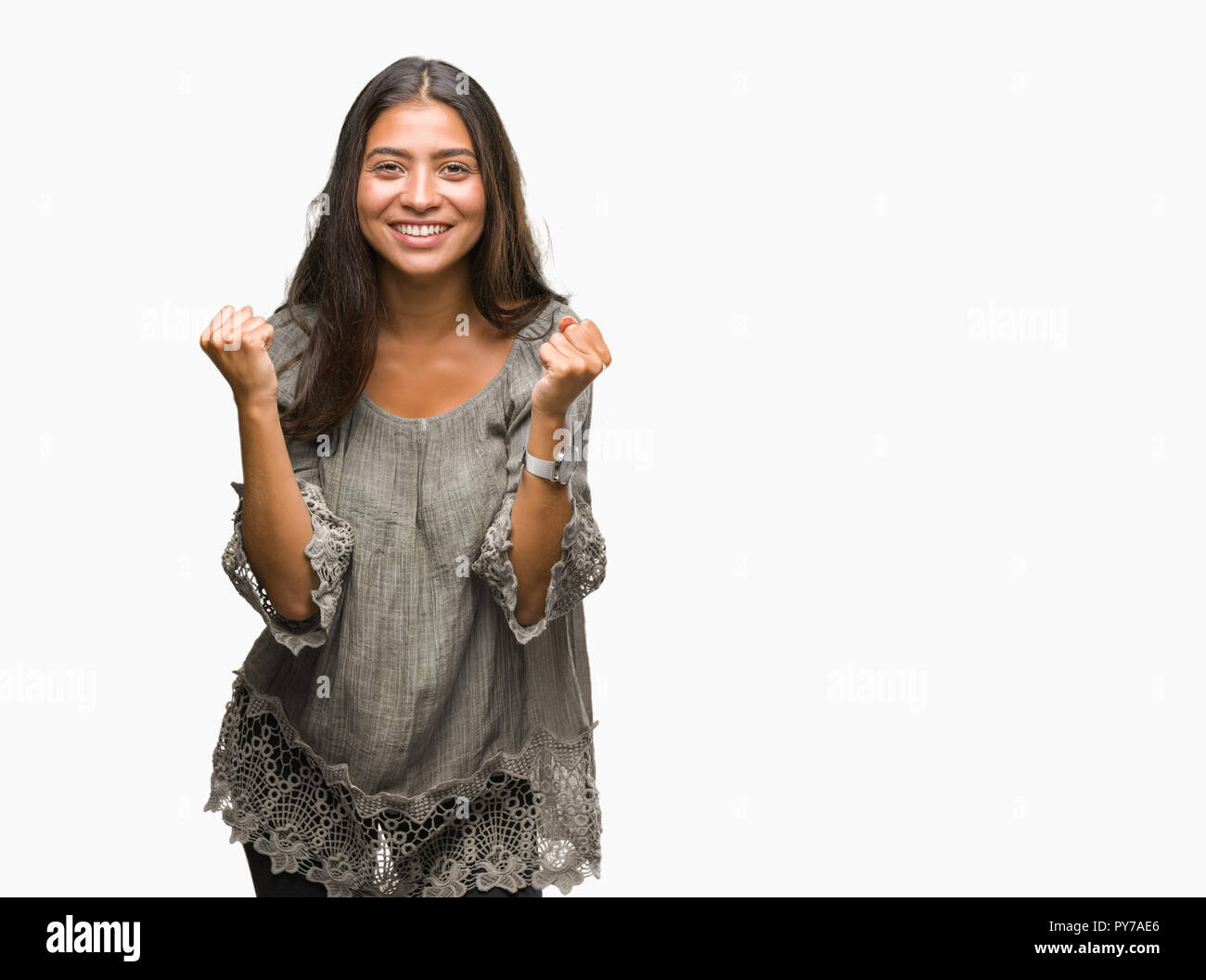Young beautiful arab woman over isolated background celebrating ...