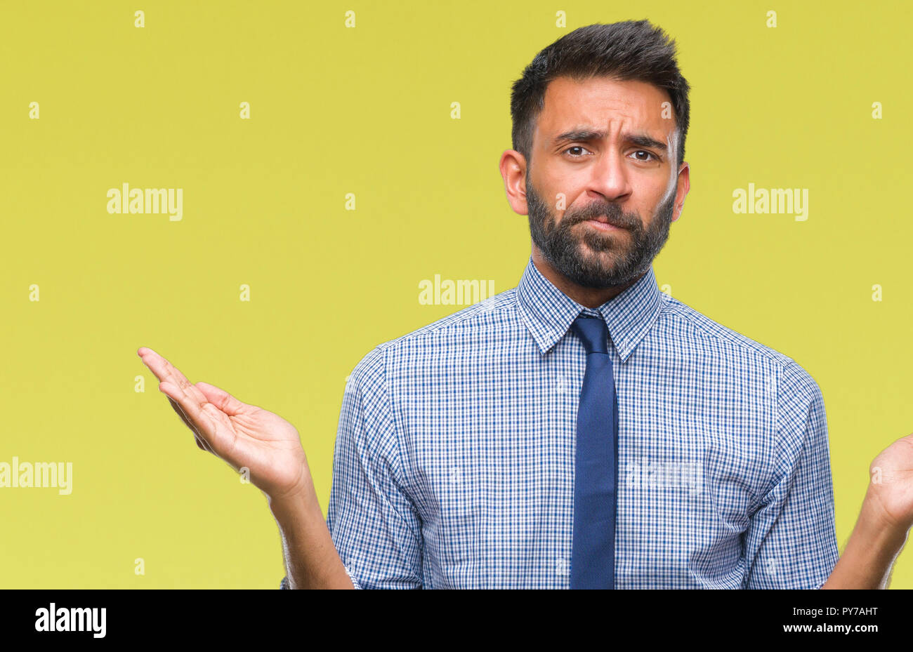 Adult hispanic business man over isolated background clueless and ...