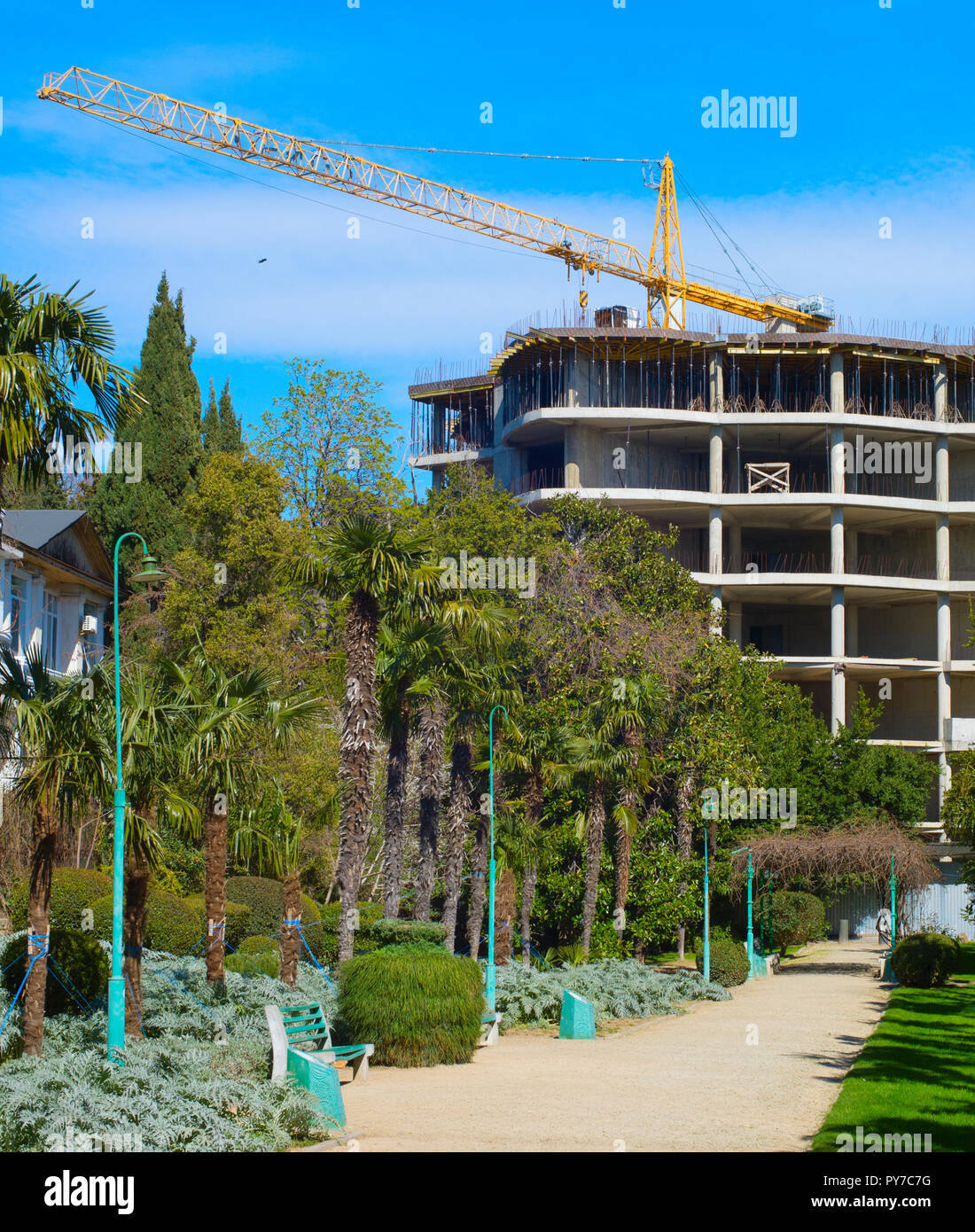 Construction site of a modern apartment building in a park. Crimea ...