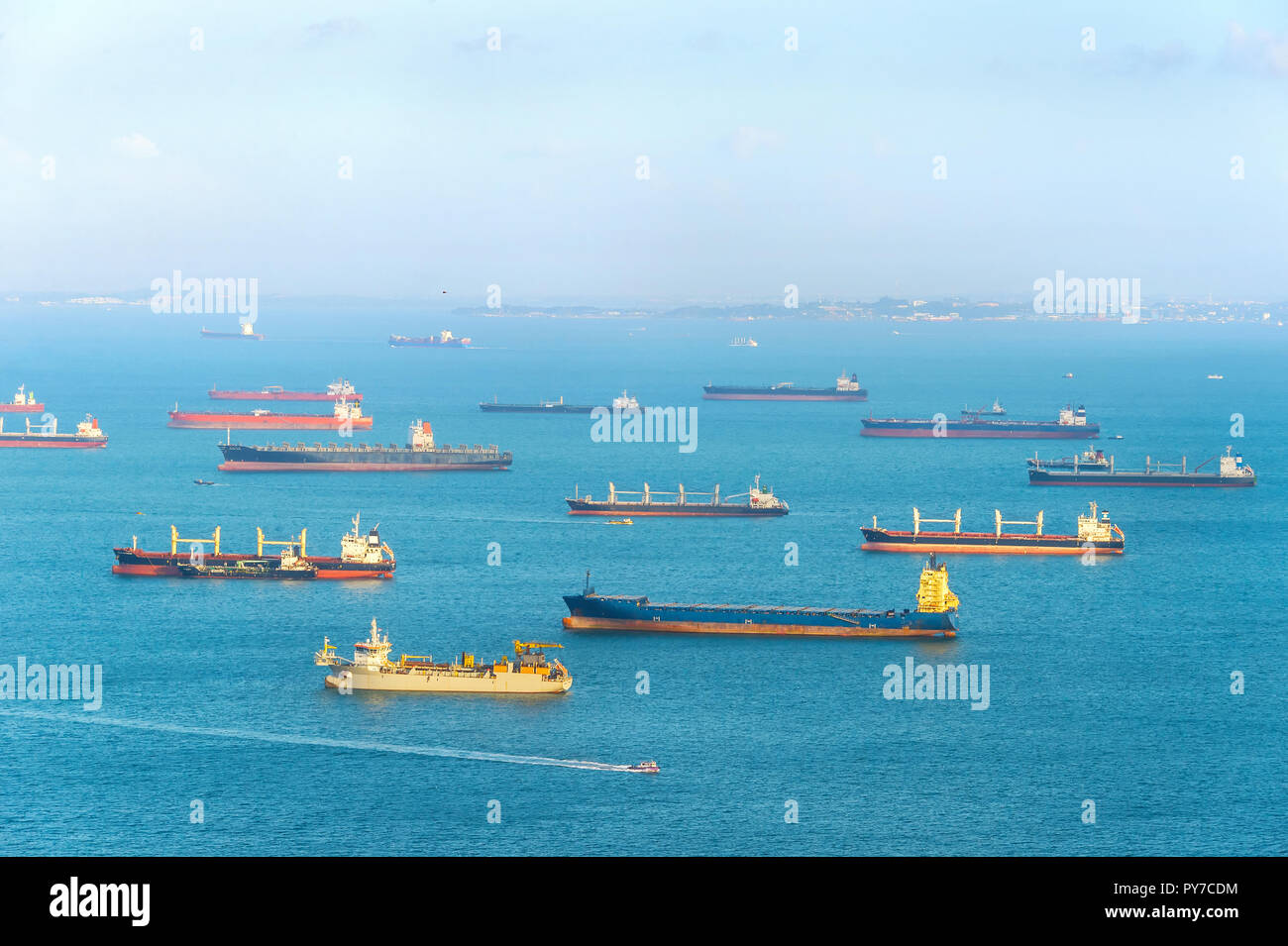 Industrial cargo shipping tankers in Singapore harbor Stock Photo - Alamy