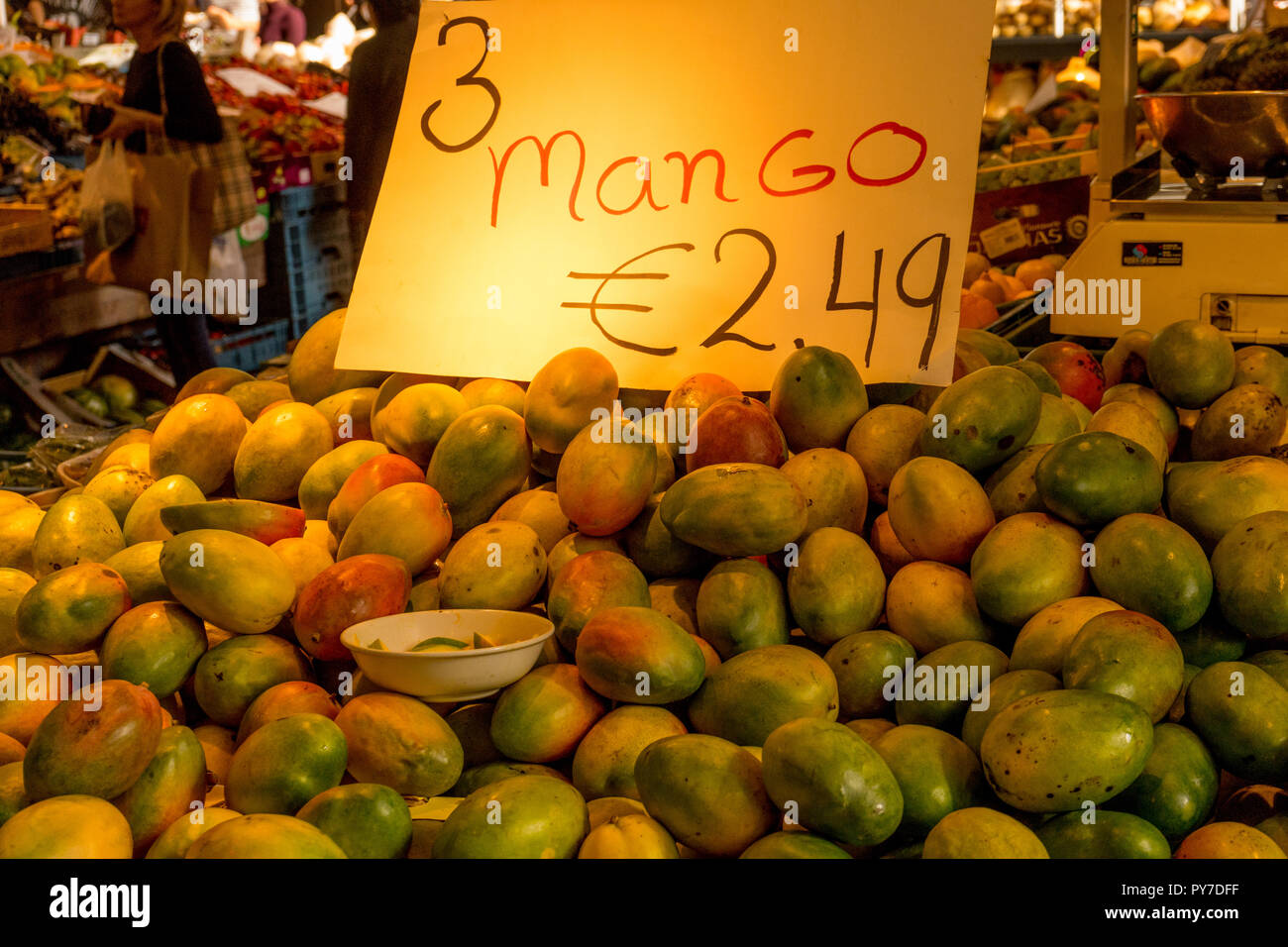 Netherlands, Rotterdam, a group of mango fruit on display in a store ...