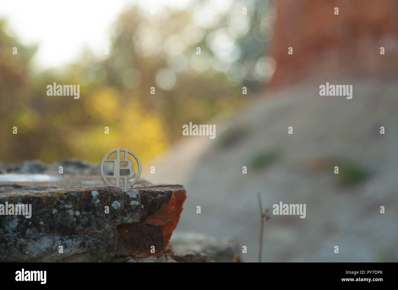 Bit coin on the old stone and brick wall Stock Photo - Alamy