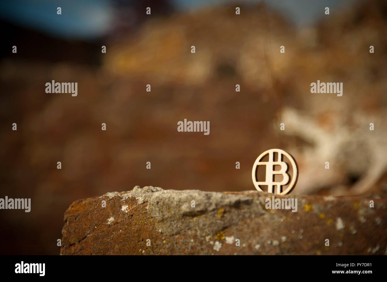 Bit coin on the old stone and brick wall Stock Photo - Alamy