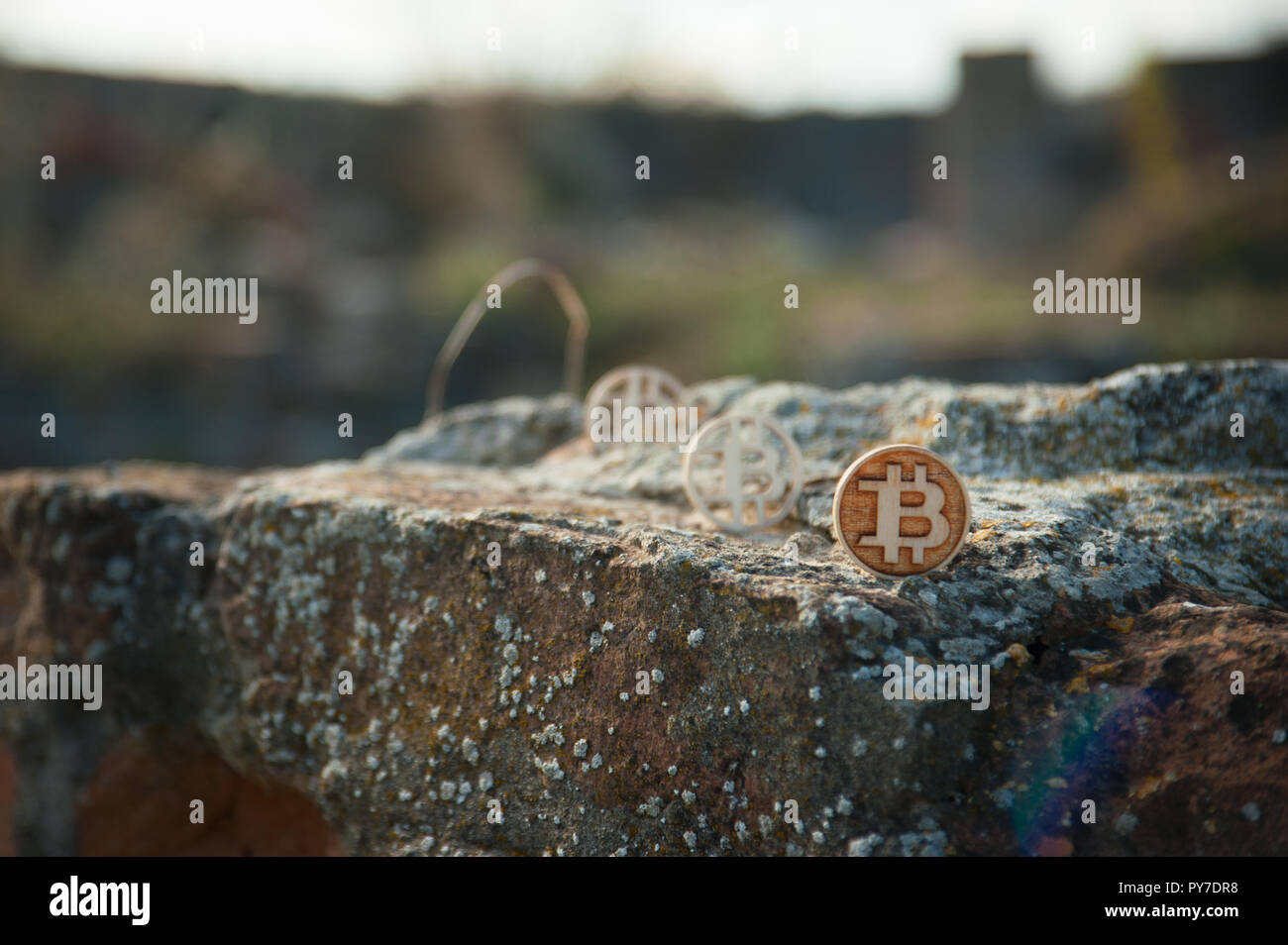 Bit coin on the old stone and brick wall Stock Photo - Alamy