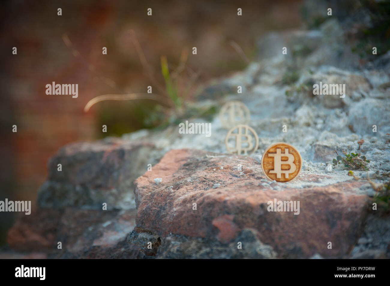 Bit coin on the old stone and brick wall Stock Photo - Alamy