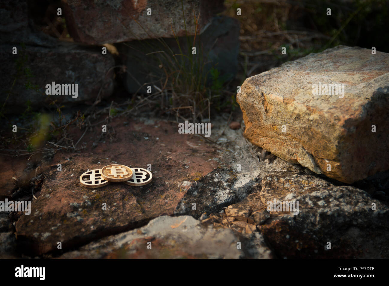 Bit coin on the old stone and brick wall Stock Photo - Alamy