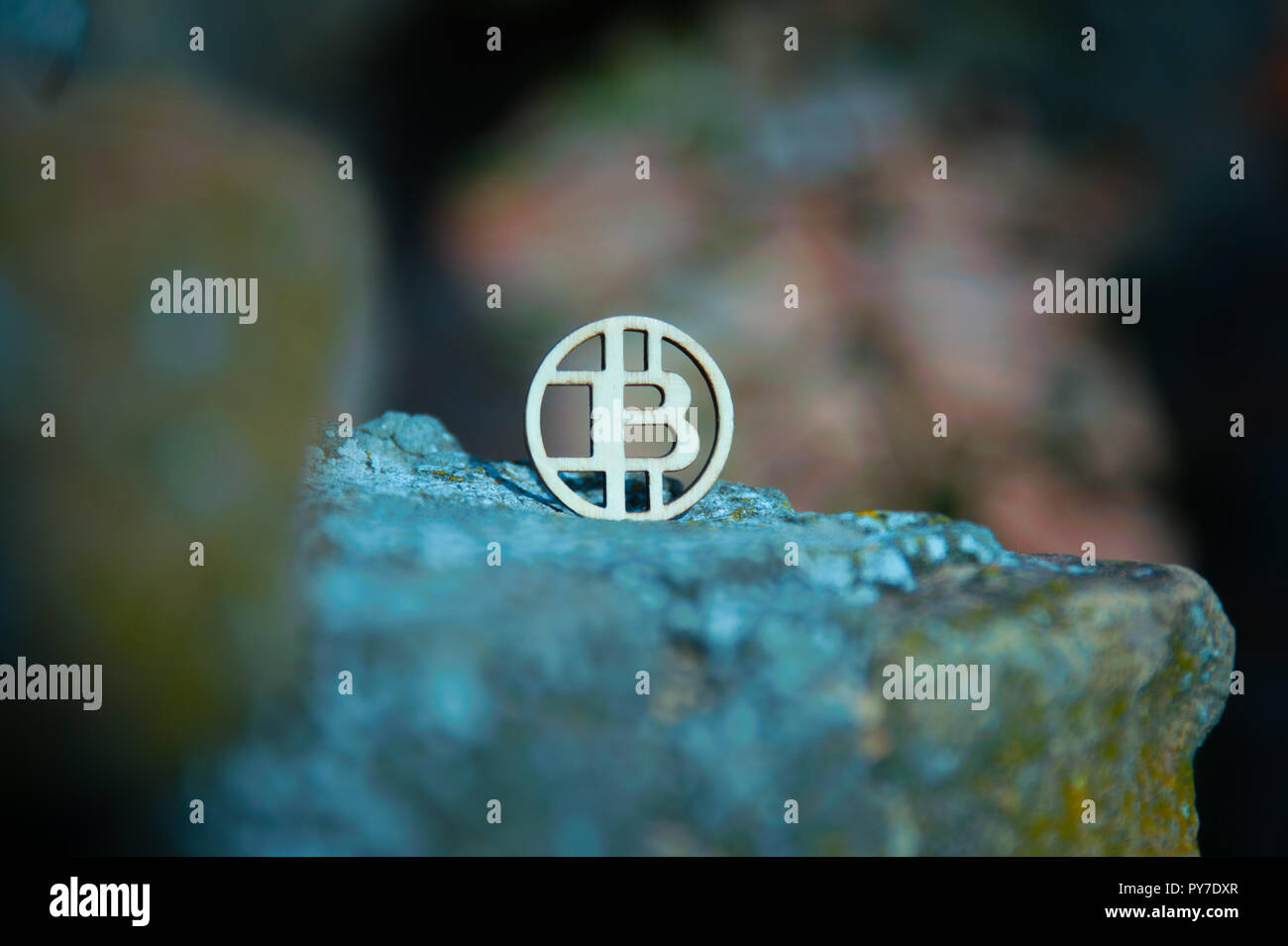 Bit coin on the old stone and brick wall Stock Photo - Alamy