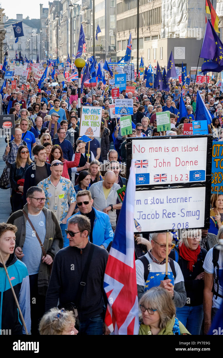 Crowd marching along Pall Mall with Eu flags, Uk flags and placards ...