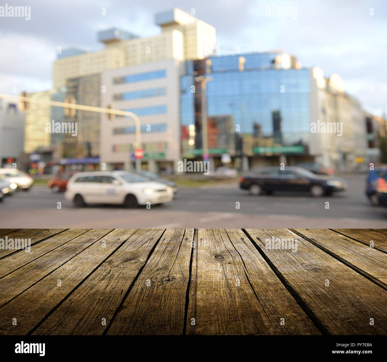 Empty wooden deck table with city in background. Ready for product ...