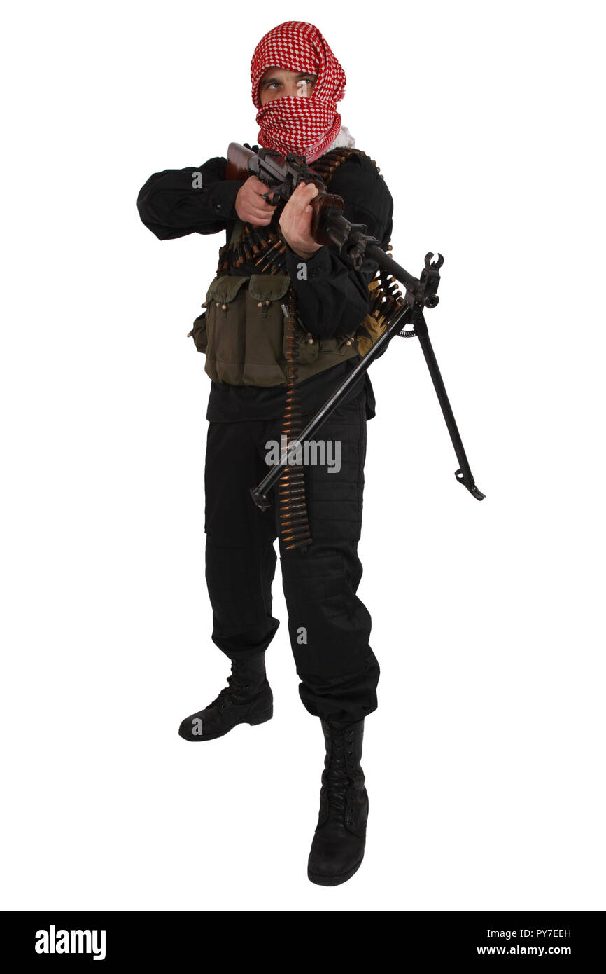 Rebel army soldier in black uniform with red kufiya holding machine gun ...