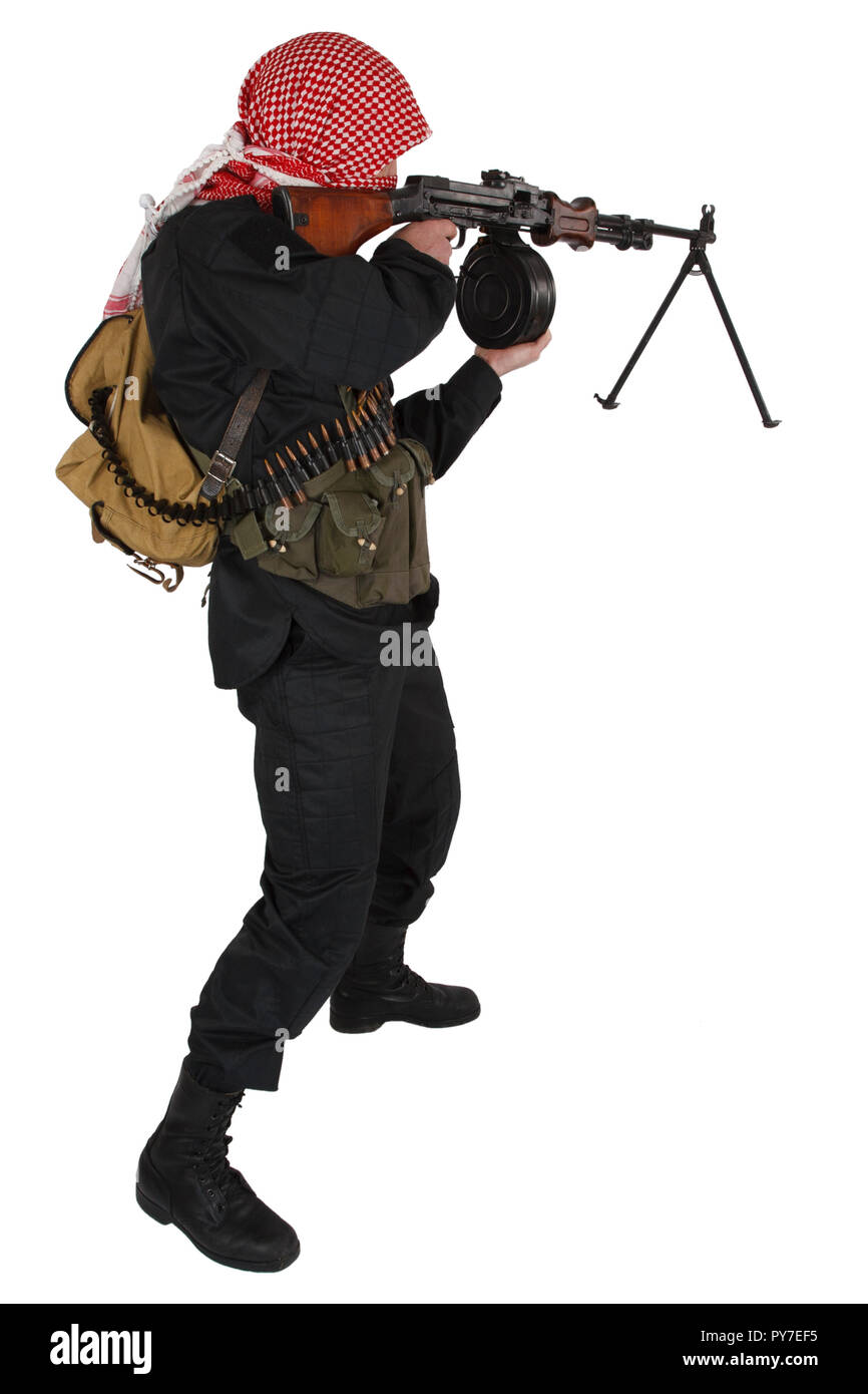 Rebel army soldier in black uniform with red kufiya holding machine gun ...