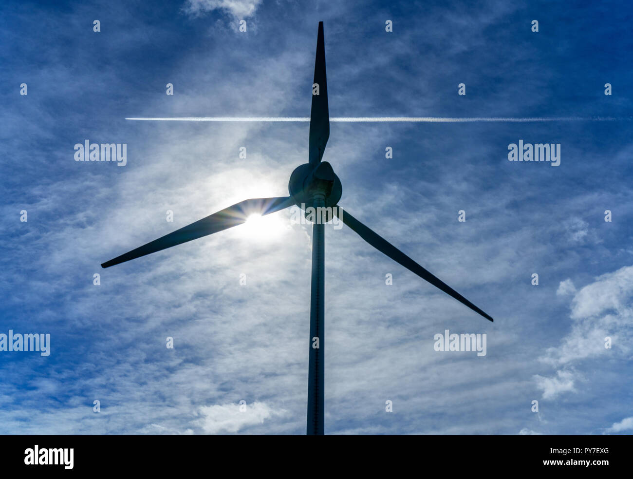 Wind turbine and jet aircraft Stock Photo - Alamy