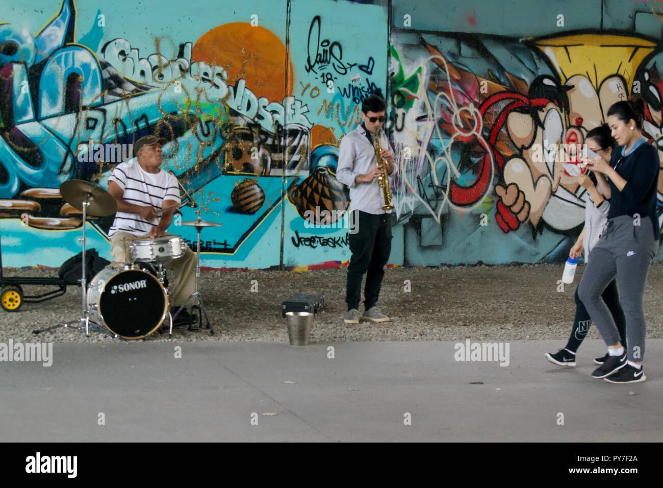 Playing for tips Stock Photo - Alamy