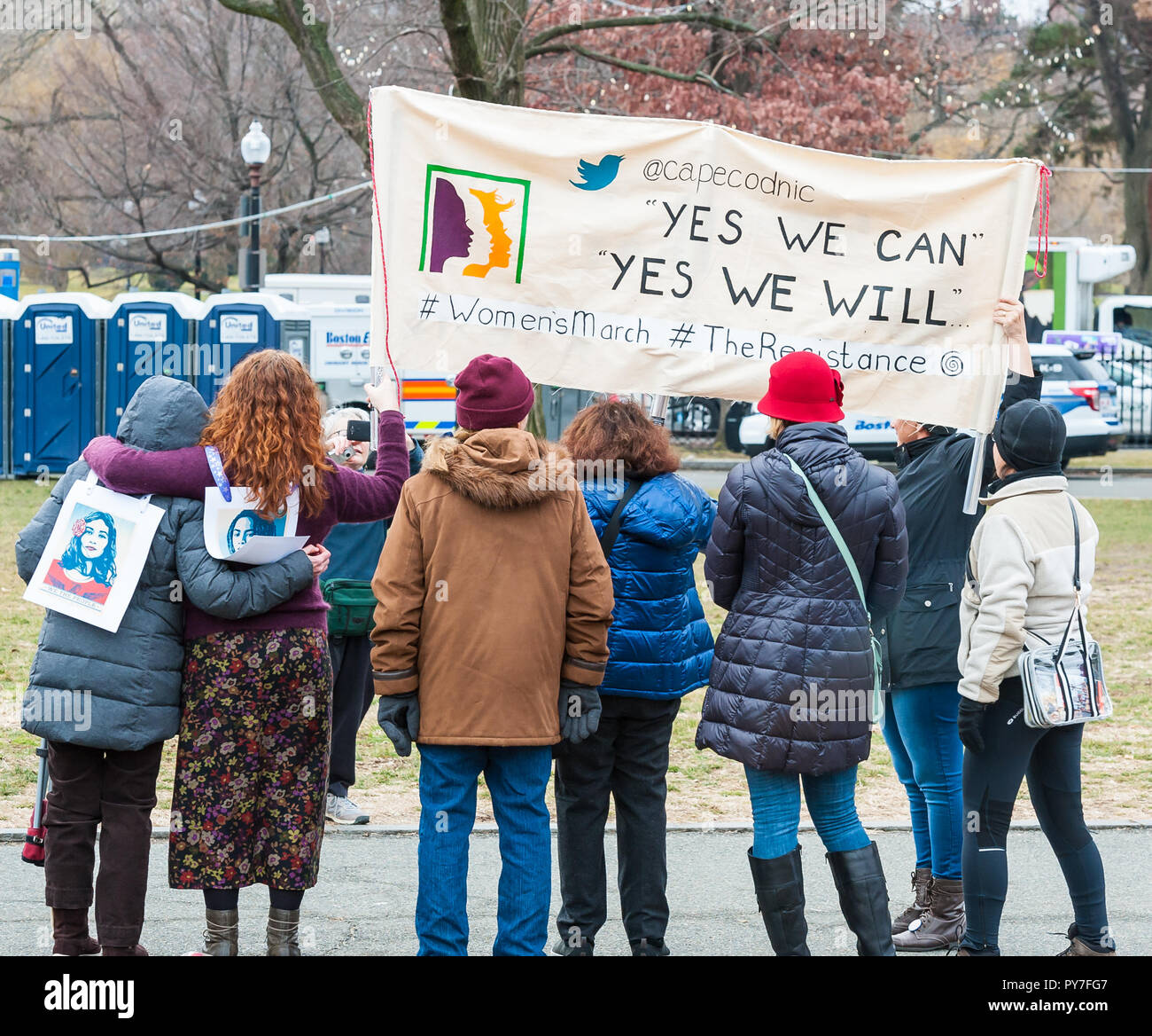 People joining the Boston Womens' March, carrying signs, and showing ...