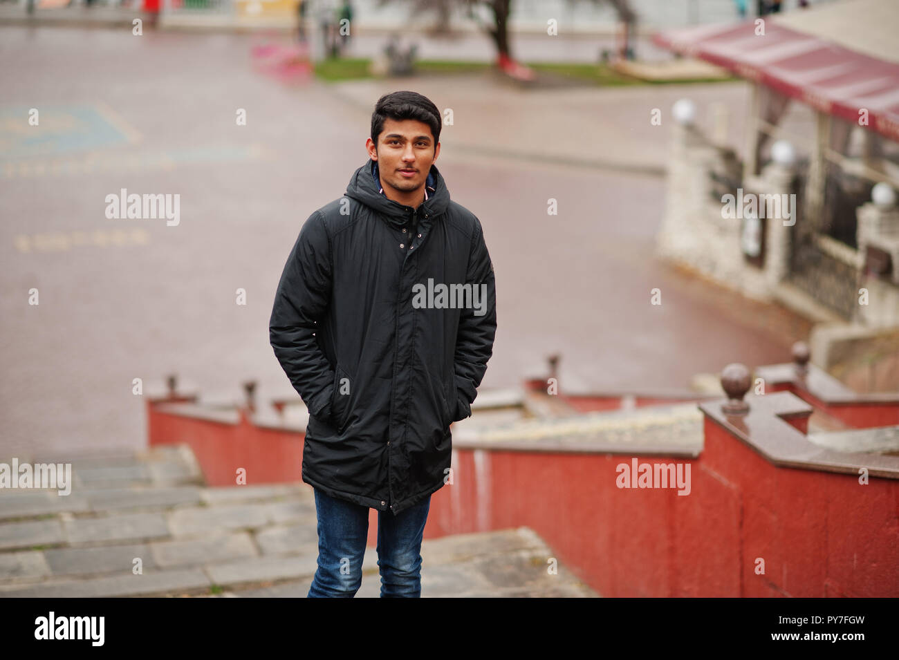 Indian man at black jacket posed outdoor Stock Photo - Alamy