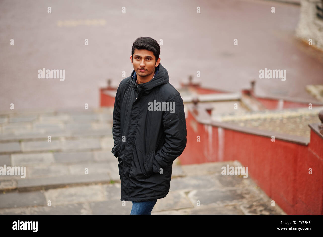 Indian man at black jacket posed outdoor Stock Photo - Alamy