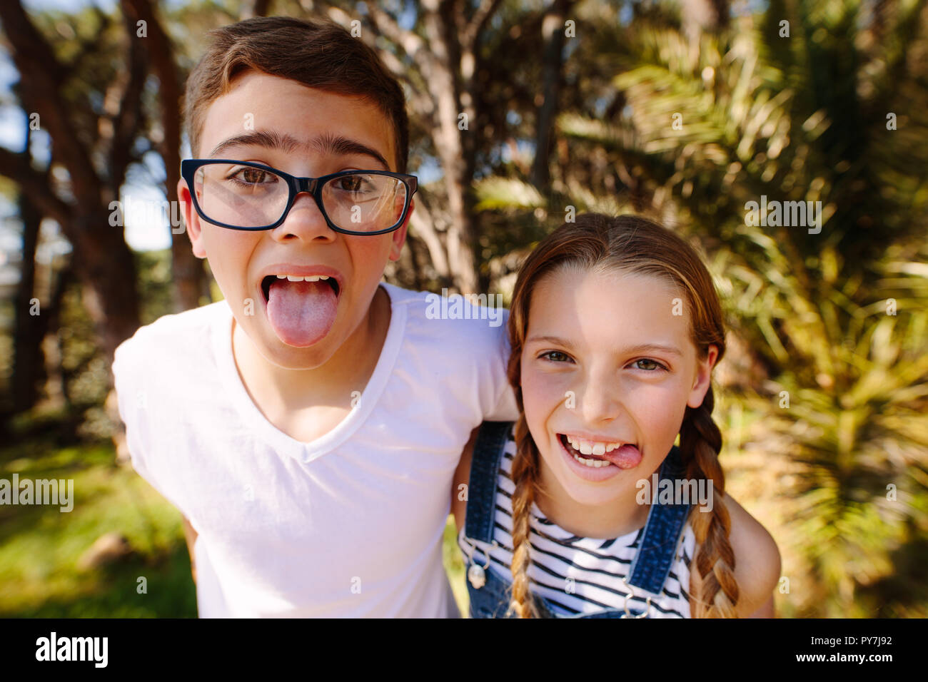 Boy and girl standing together hi-res stock photography and images - Alamy