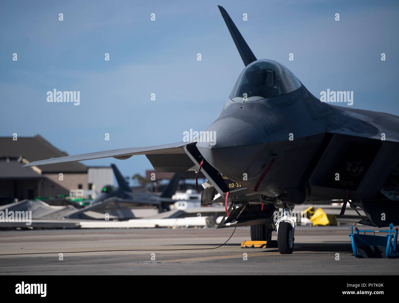 An F-22 Raptor parks on the runway at Tyndall Air Force Base, Florida ...