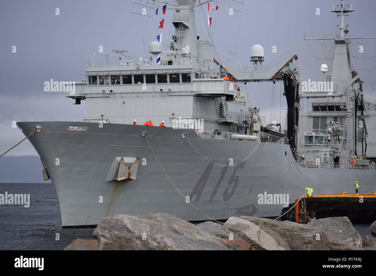 A civilian harbor worker throws off the last line for Standing NATO ...