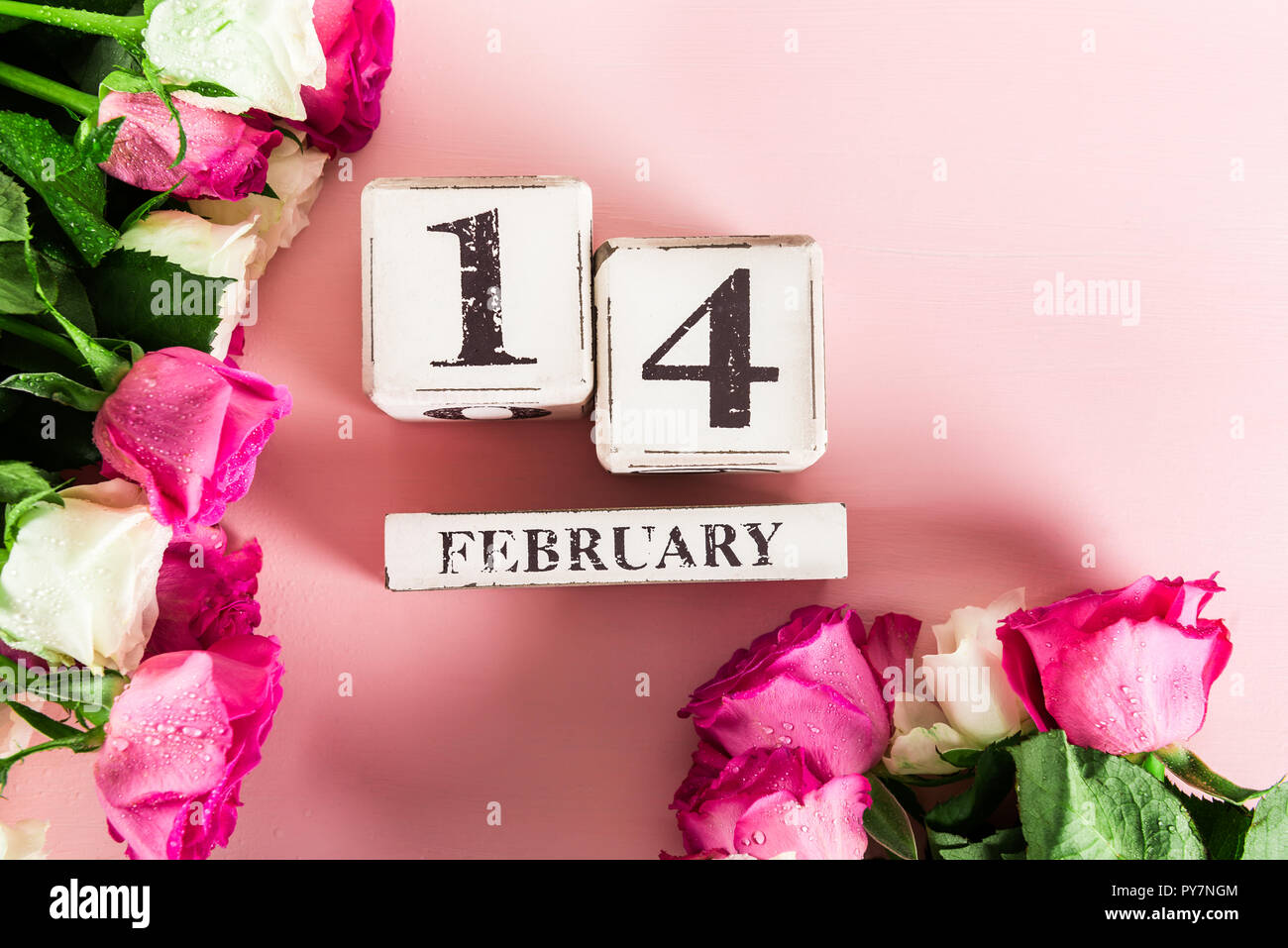 Bunch of White and Pink Roses for St Valentines Day with wooden block ...