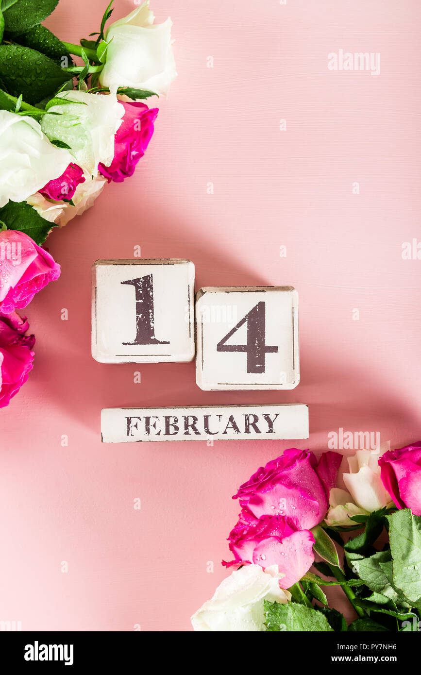 Bunch of White and Pink Roses for St Valentines Day with wooden block ...