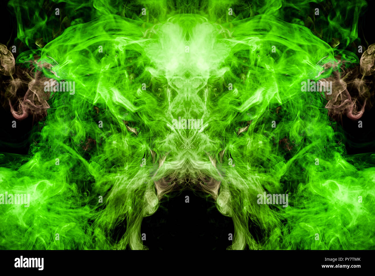 Thick colorful green smoke in the form of a skull, monster, dragon on a ...