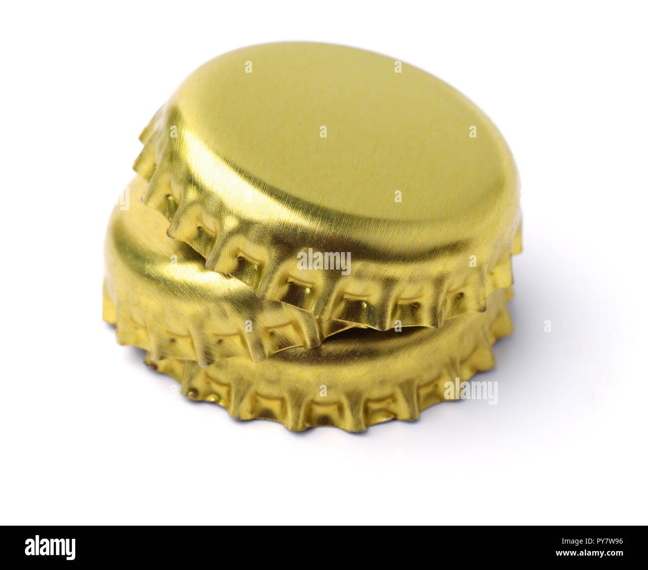 Stack of golden bottle caps isolated on white Stock Photo - Alamy