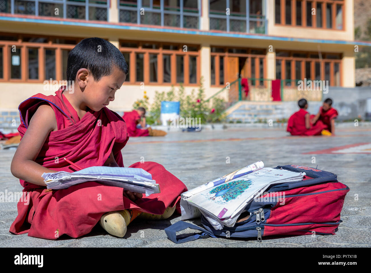 A small school boy studding outside at Likir Monastery or Likir Gompa ...