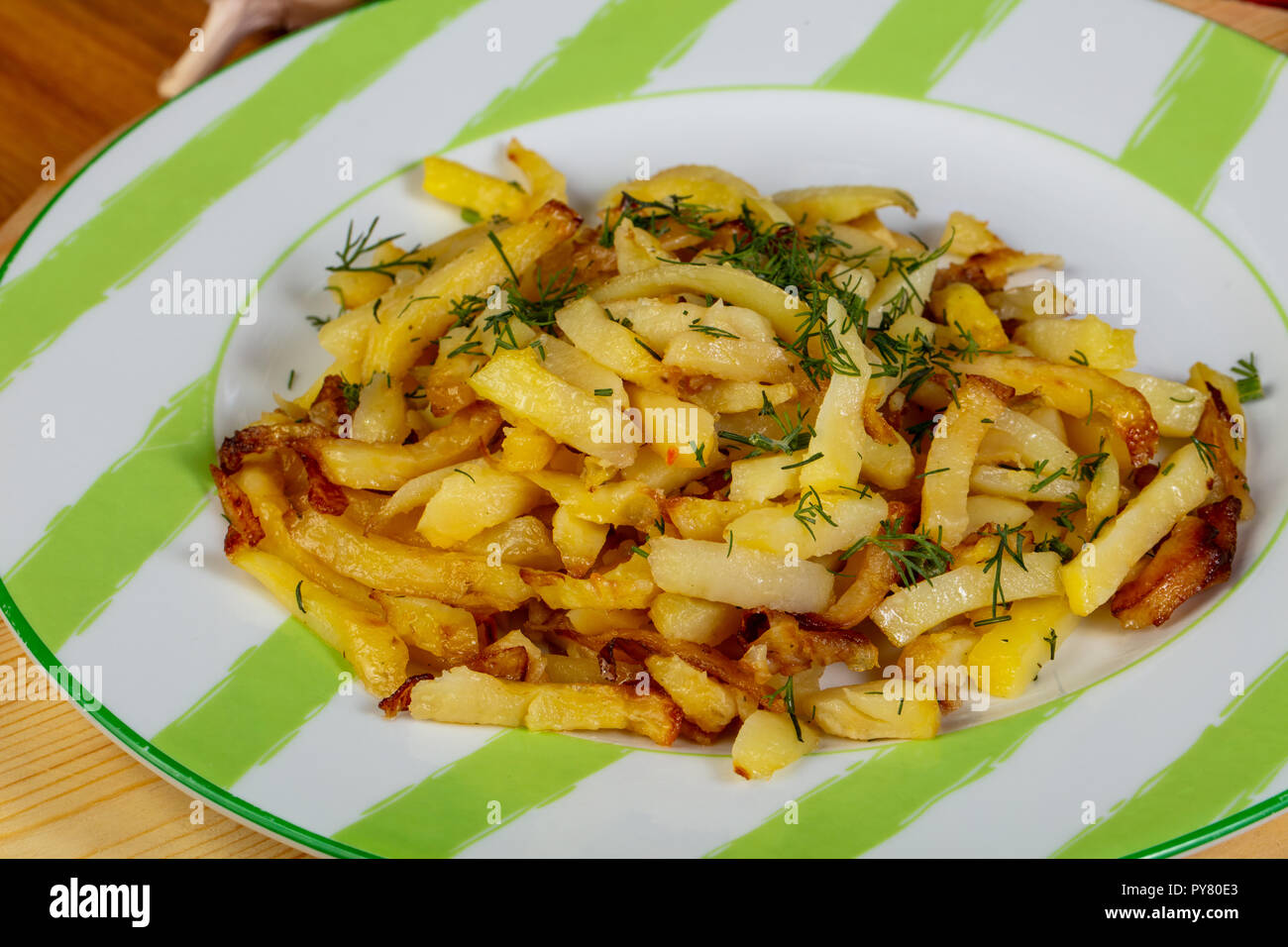 Homemade Fried potato with herbs Stock Photo - Alamy