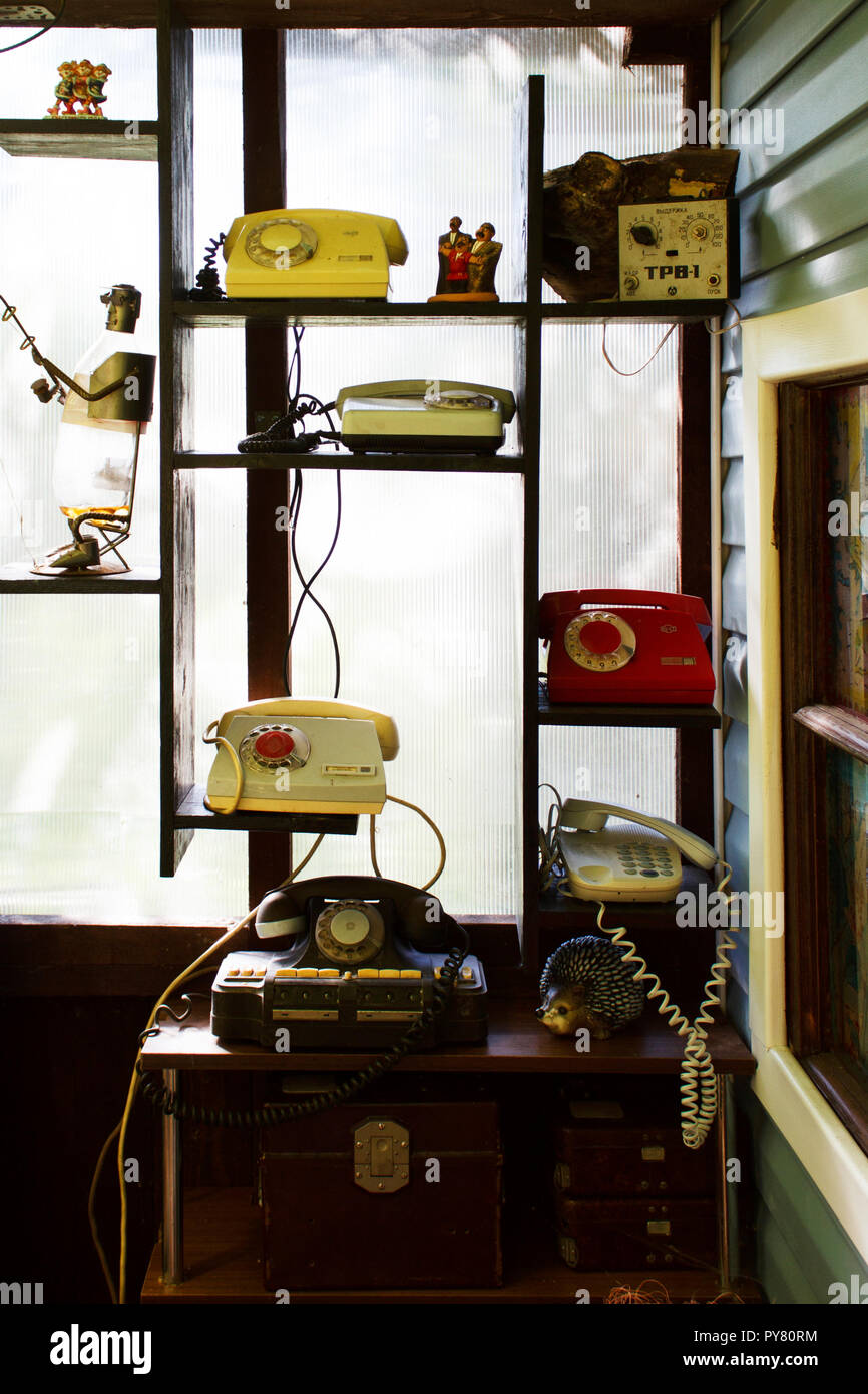 Vintage rotary telephones on the shelf as part of the collection ...