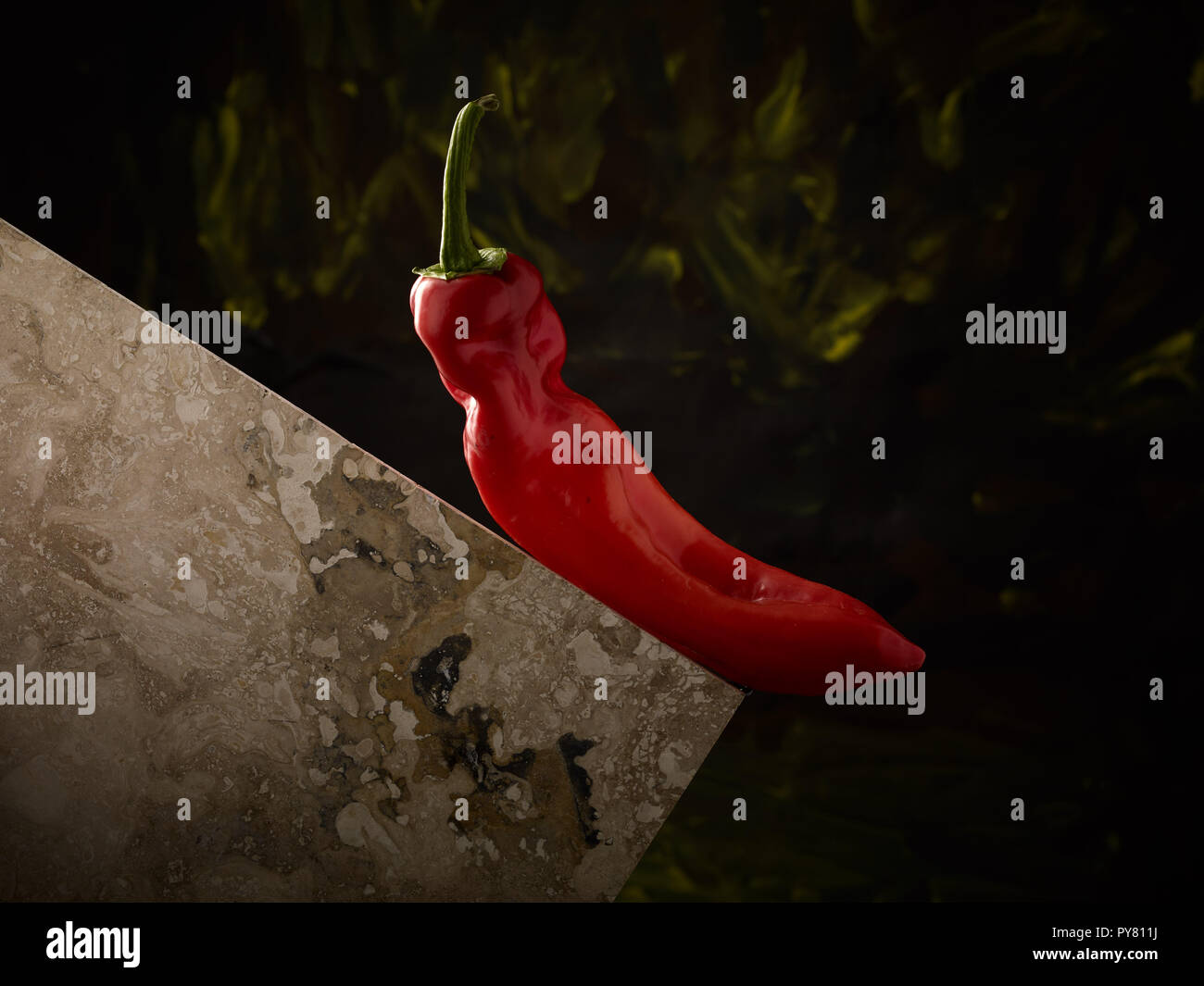 Red pepper on tile slope still-life Stock Photo - Alamy