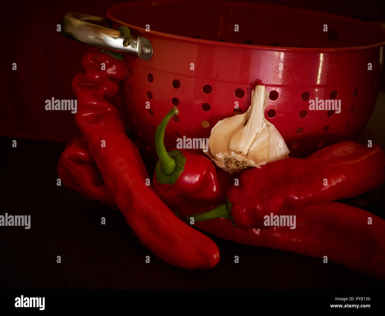 garlic, red pepper and cylinder food still-life Stock Photo - Alamy