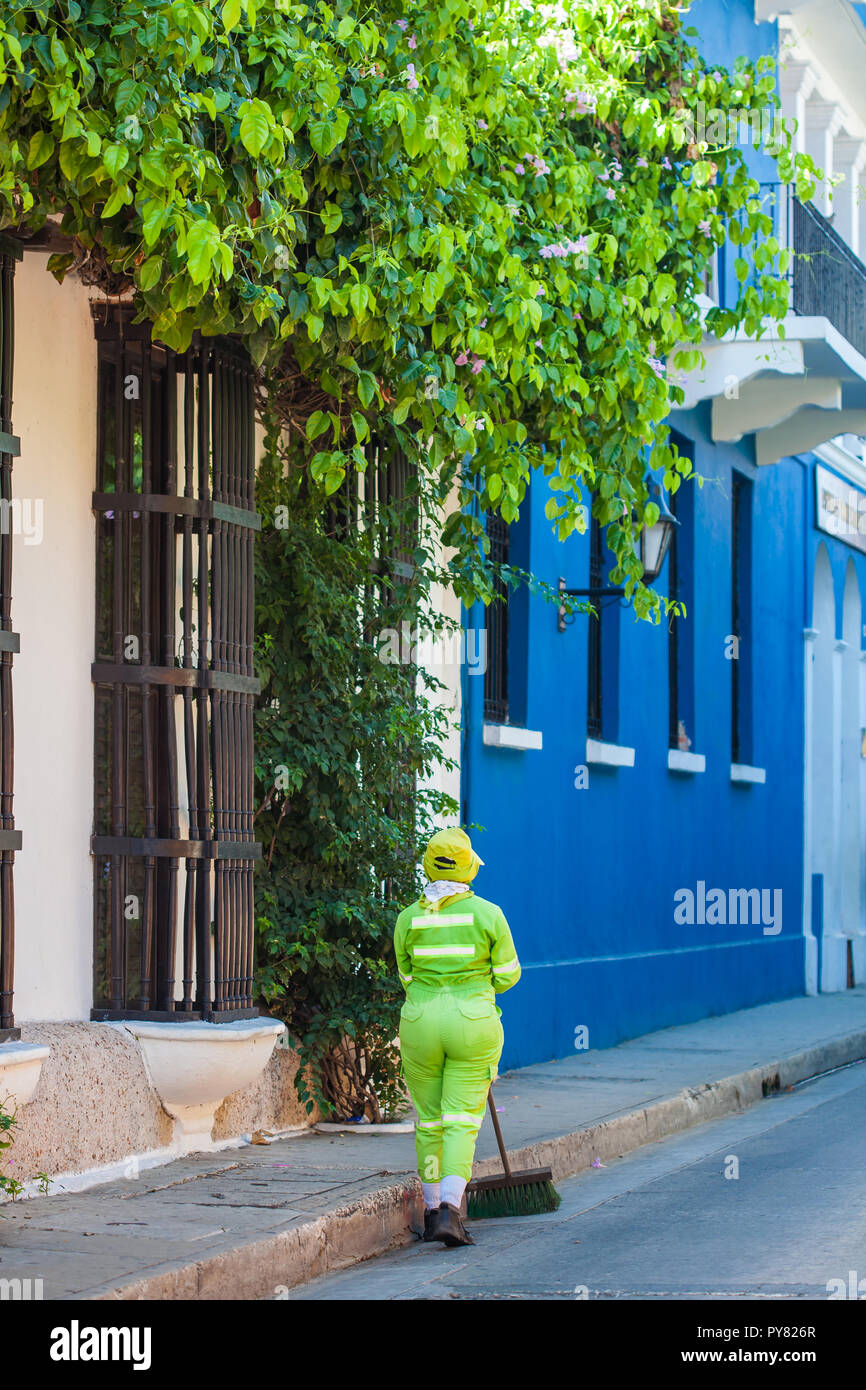 Old woman sweeping street hi-res stock photography and images - Alamy