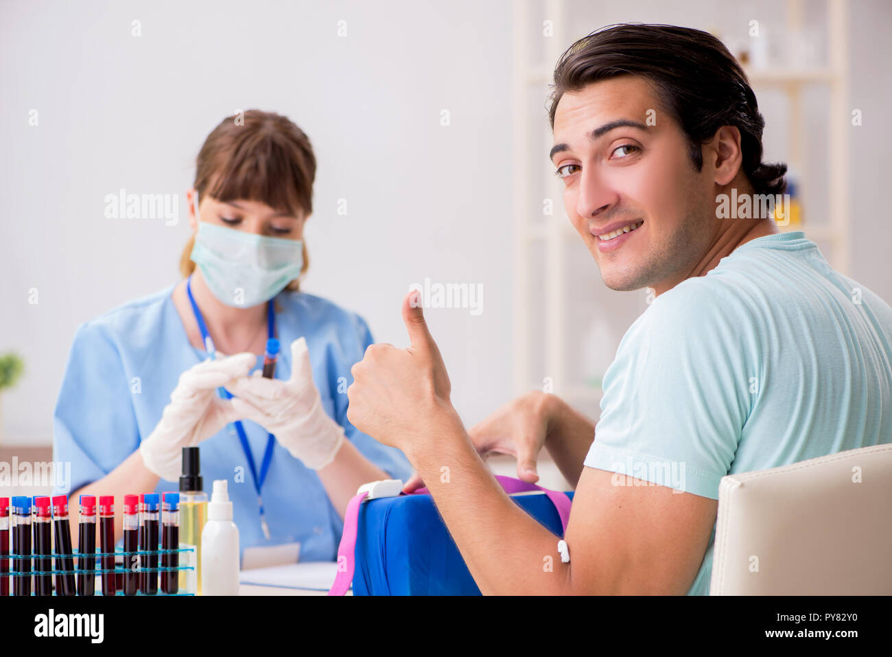 Young patient during blood test sampling procedure Stock Photo - Alamy