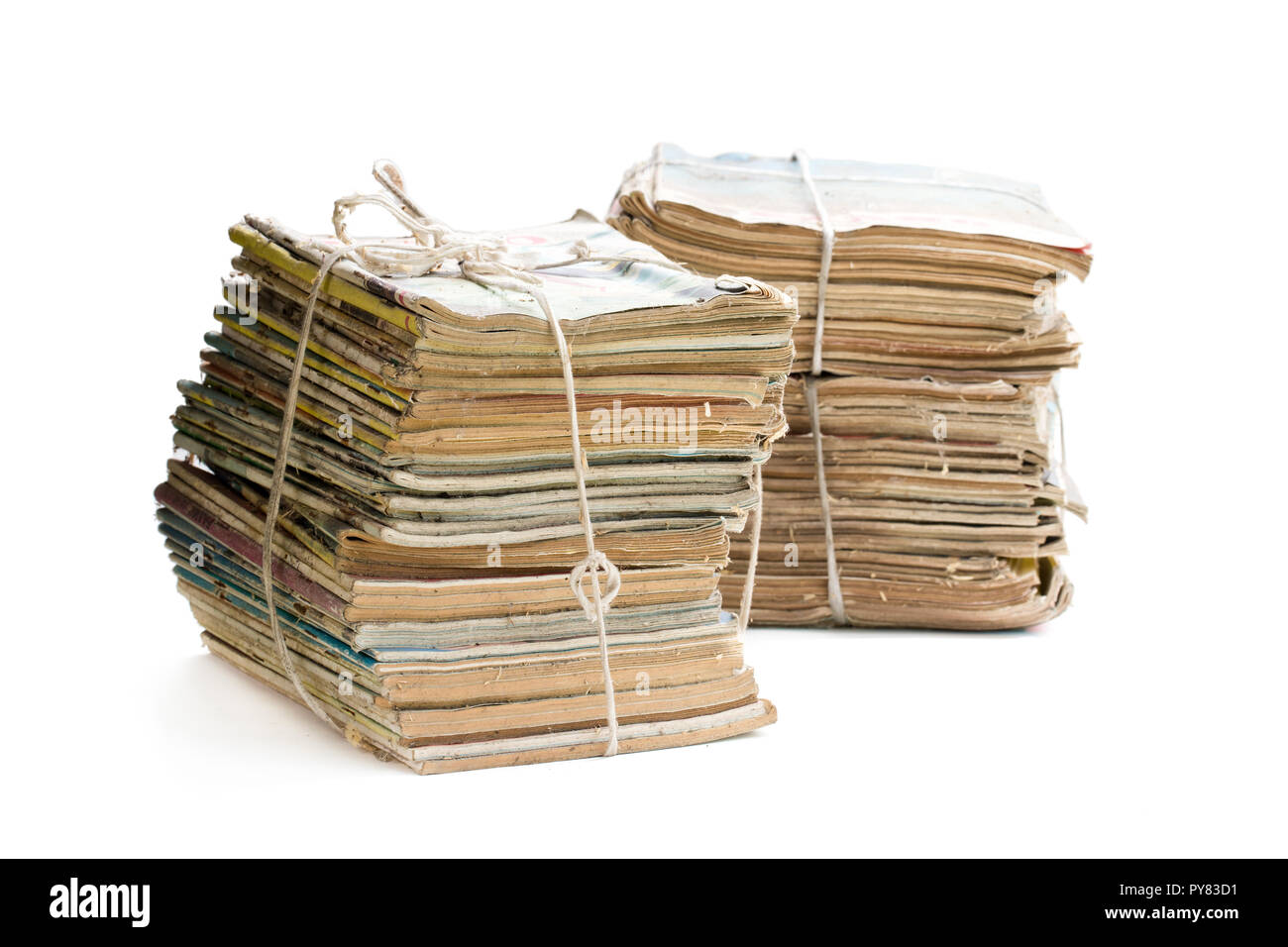 Stacks of old and dusty magazines isolated on white Stock Photo - Alamy