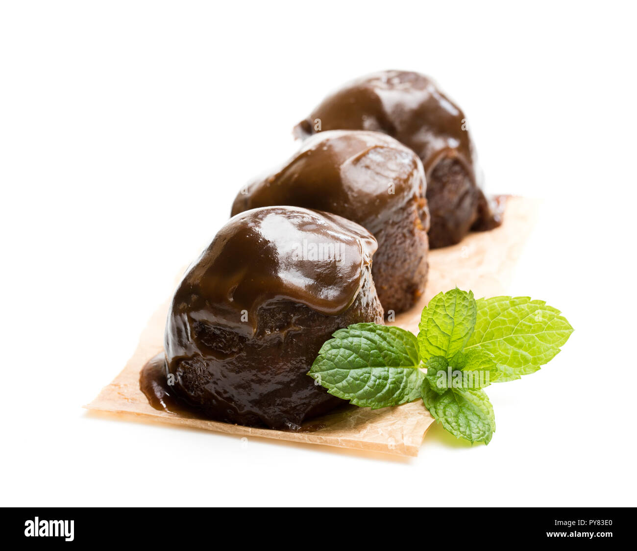 Sticky chocolate puddings isolated on white Stock Photo - Alamy
