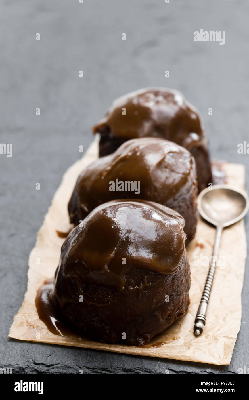 Sticky chocolate puddings isolated on white Stock Photo - Alamy