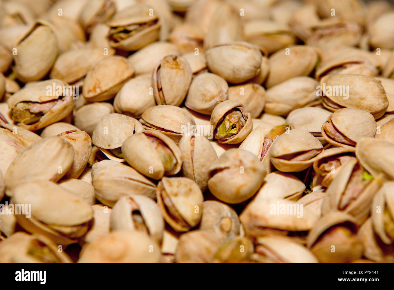 Pistachio texture. Nuts. Green fresh pistachios as texture. Roasted salted pistachio nuts ...