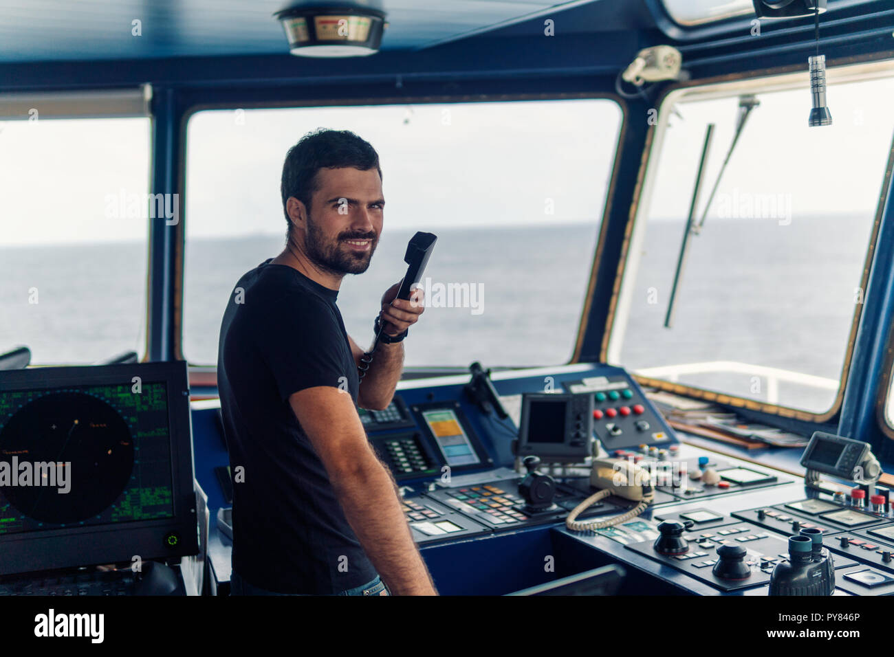 Marine navigational officer is reporting by VHF radio Stock Photo - Alamy