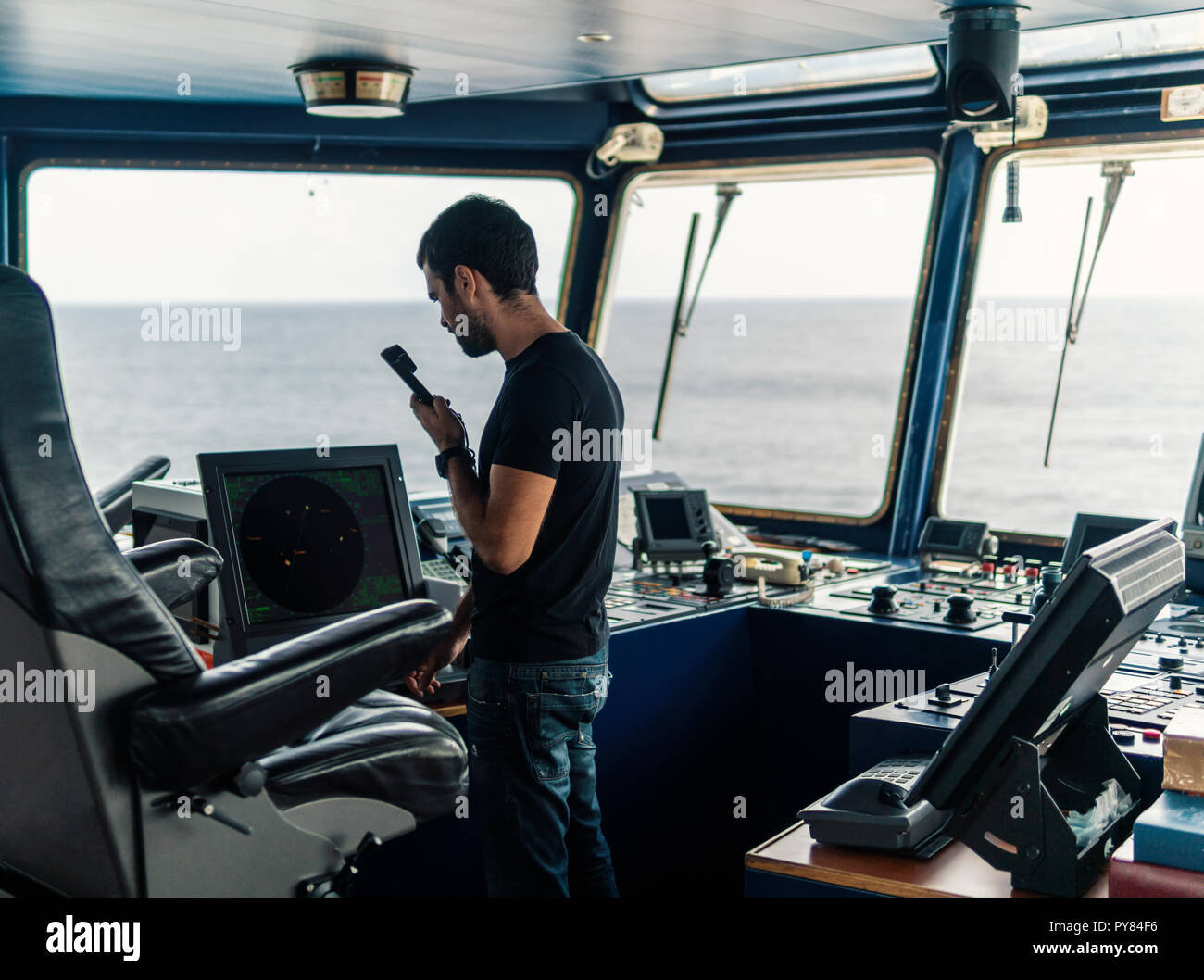 Marine navigational officer is reporting by VHF radio Stock Photo - Alamy