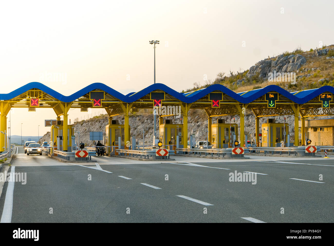 Cars passing through the toll gate on the motorway Stock Photo - Alamy