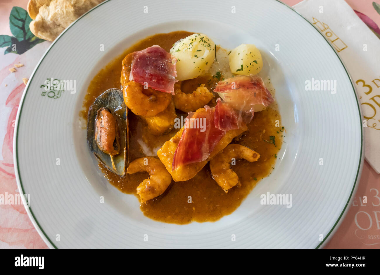 Cod fish with prawns and boiled potatoes at El 3 de Oro restaurant in ...