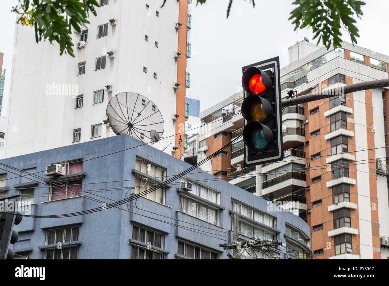 Traffic Light between buildings Stock Photo - Alamy