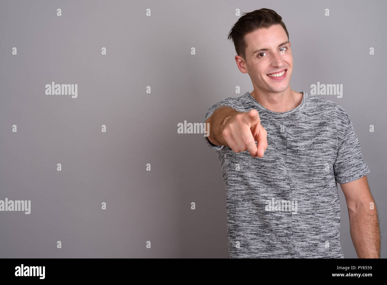 Happy man pointing finger camera hi-res stock photography and images ...