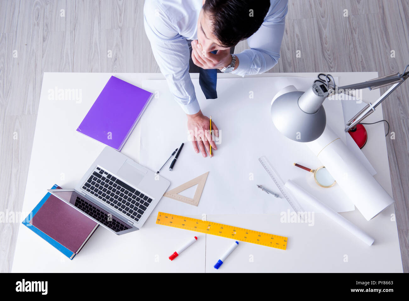 Engineer working on new project drawings Stock Photo - Alamy
